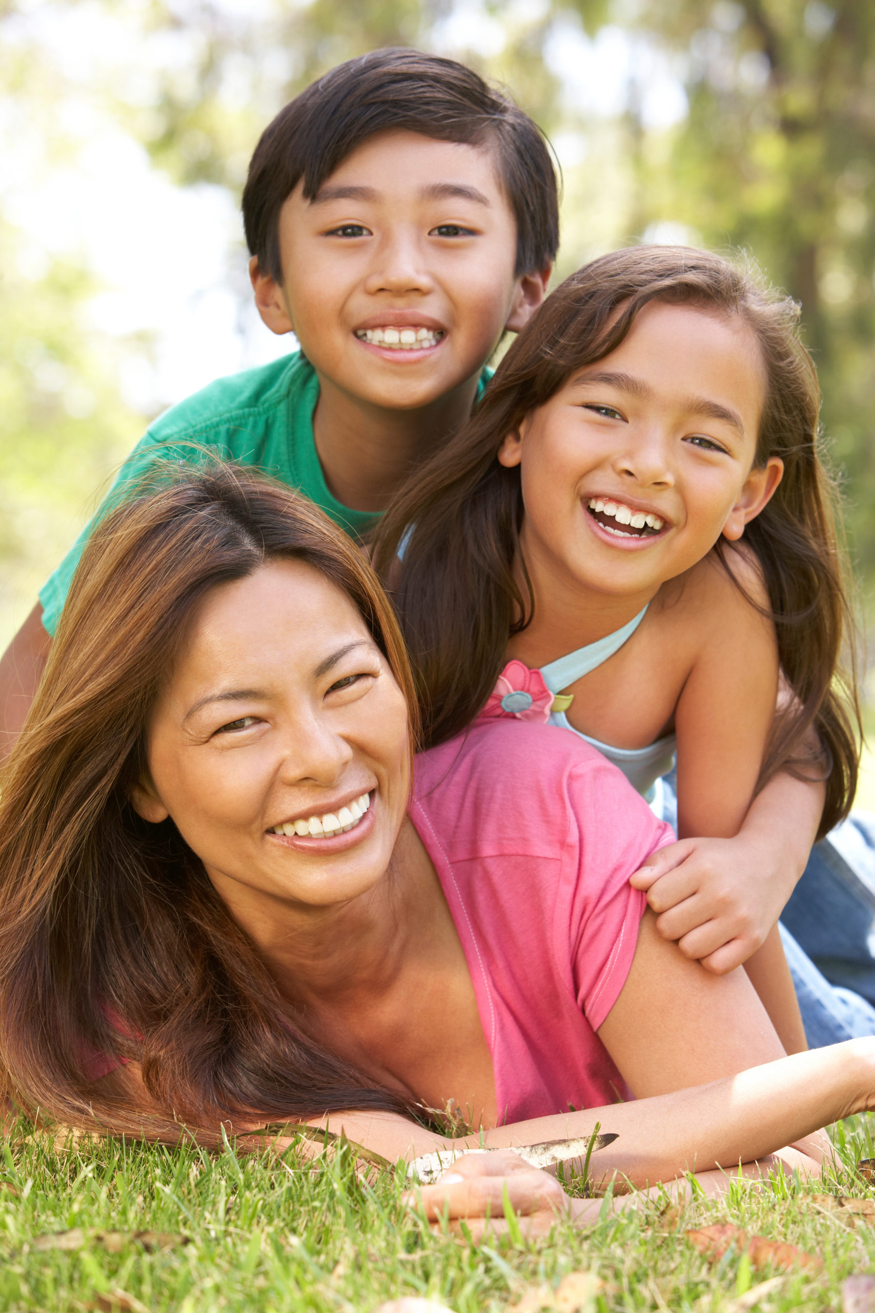 Mother And Children Enjoying Day In Park - Wesley Family Services